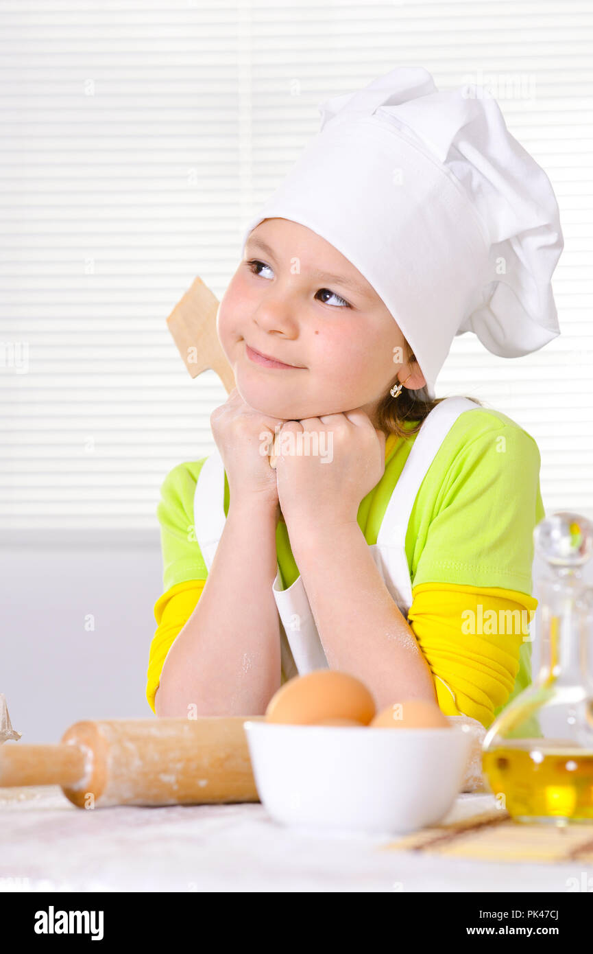 Cute girl baking cake in the kitchen Stock Photo - Alamy