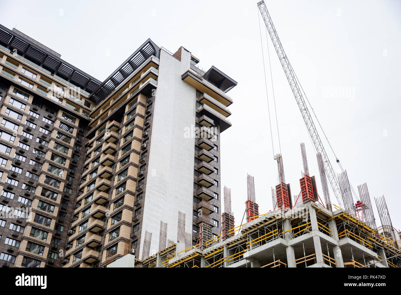 inside building sites under construction and cranes with blue sky ...