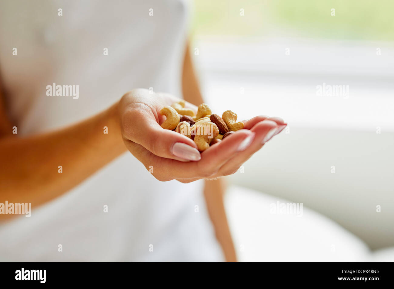 Woman nuts hi-res stock photography and images - Alamy