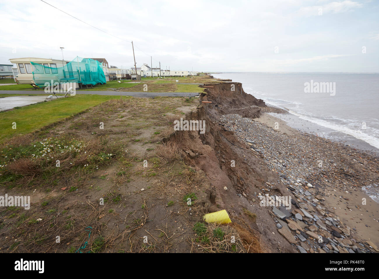 Coastal Erosion cliffs, remains of a caravan site that has collapsed ...