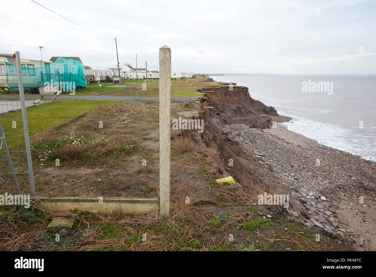 Coastal Erosion cliffs, remains of a caravan site that has collapsed ...
