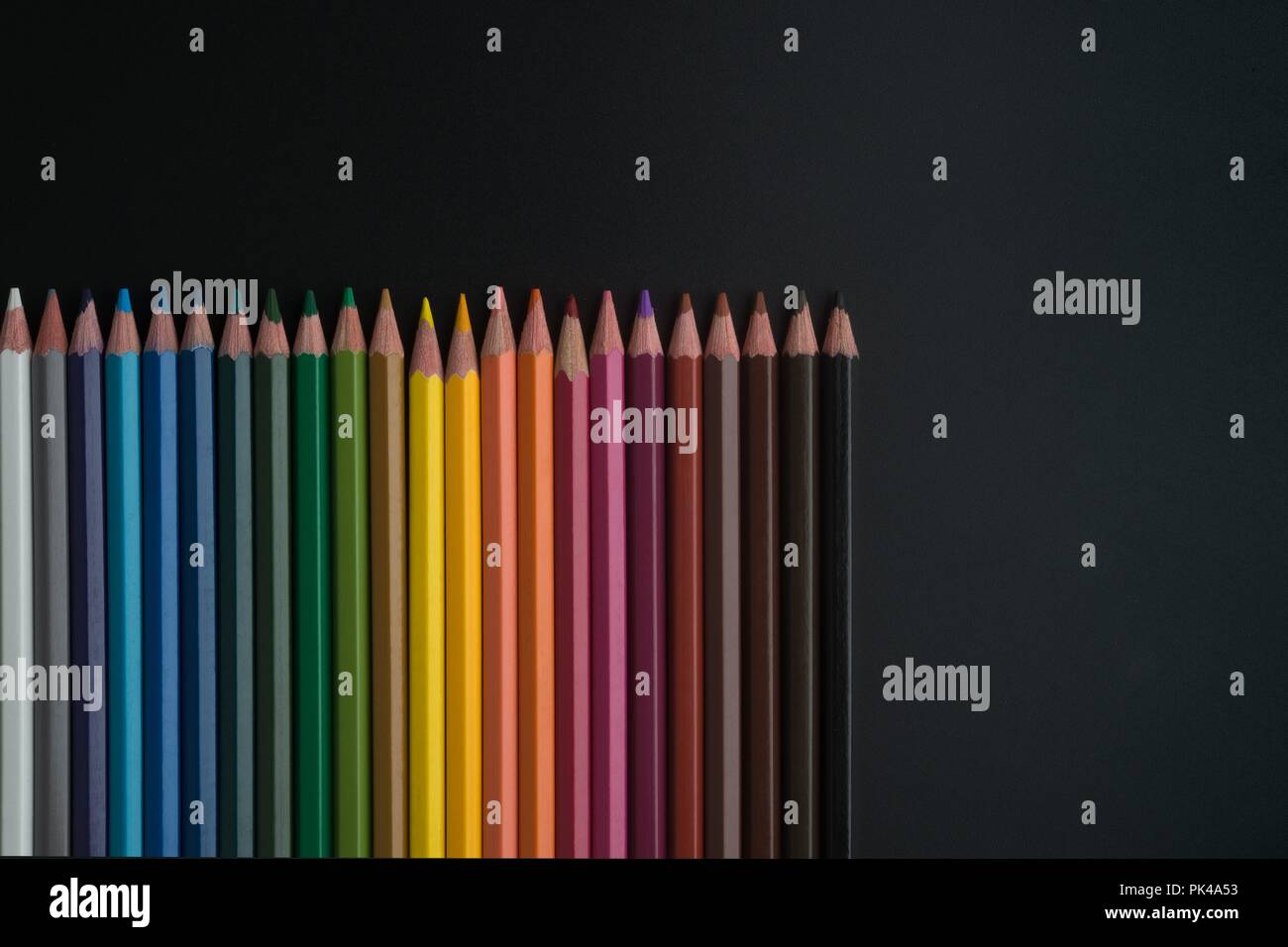 color pencils on black background close up Stock Photo - Alamy