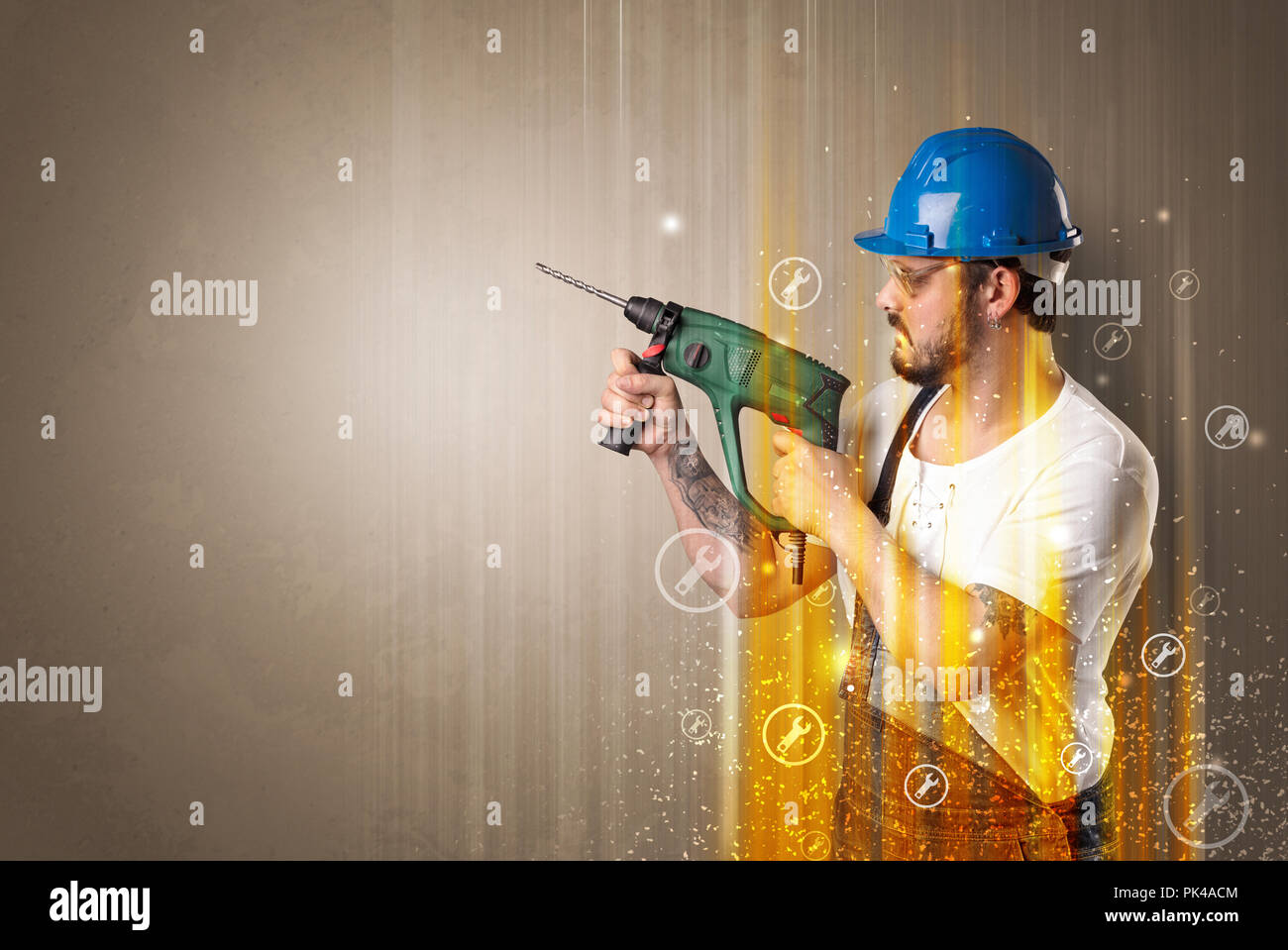 Manual worker with wrench symbols and tool Stock Photo - Alamy