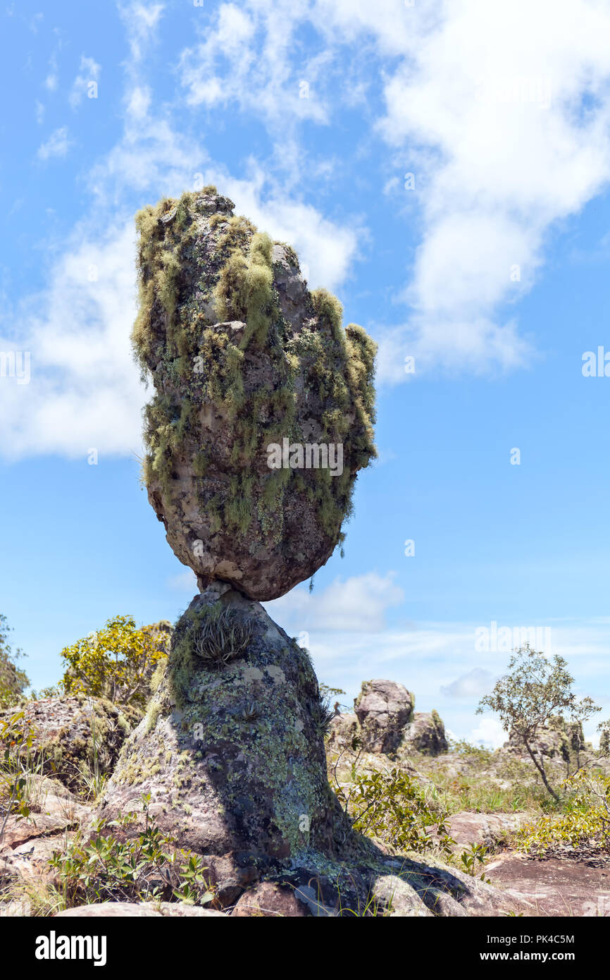 An incredible huge stone balances on a thin support. Natural phenomenon ...