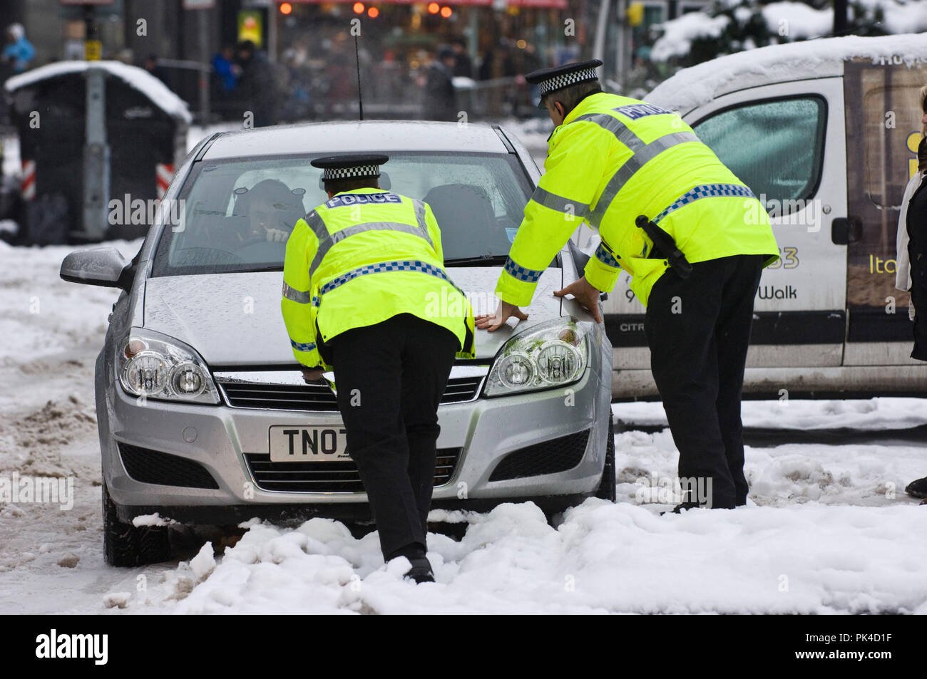 Police officers from Gayfeild Square help out a stranded motorist in ...
