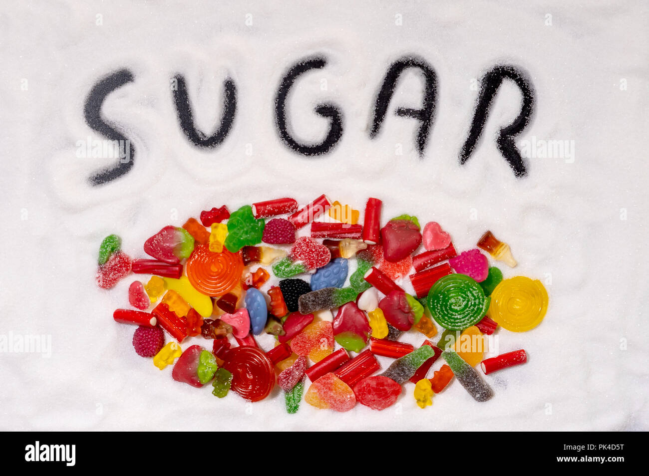 Mix of tempting sweets and candies with sugar spread and written text ...