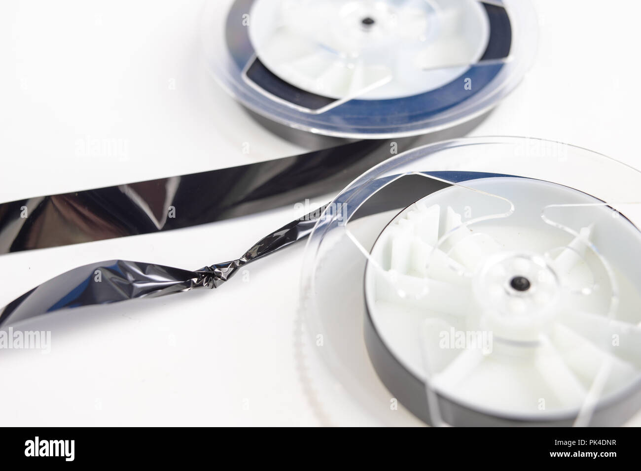 Old VHS cassette with unwound tape. Damaged data medium for old home ...