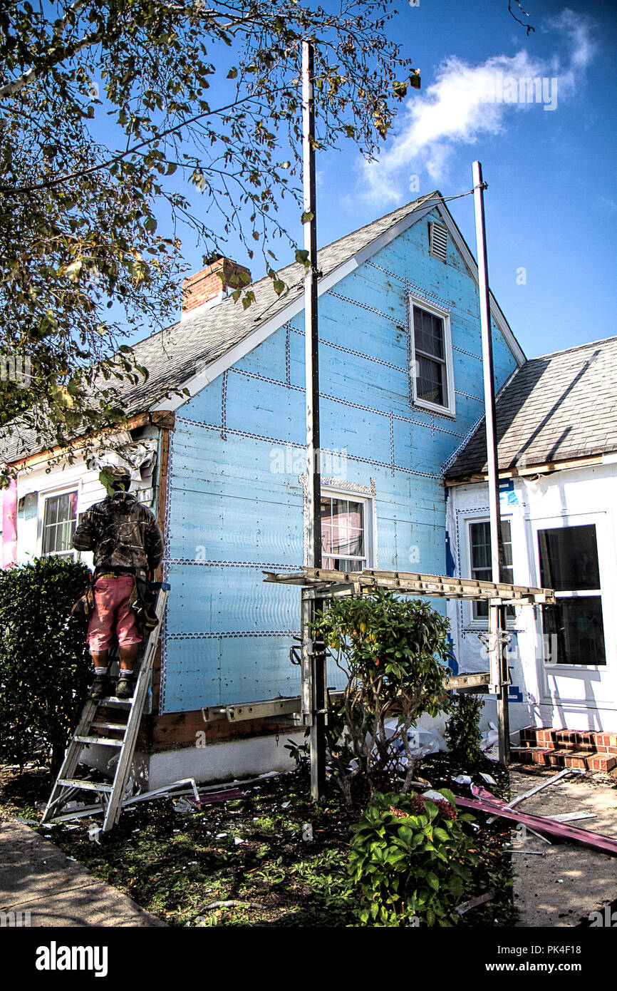 Home in the process of putting on new vinyl siding. Under construction ...