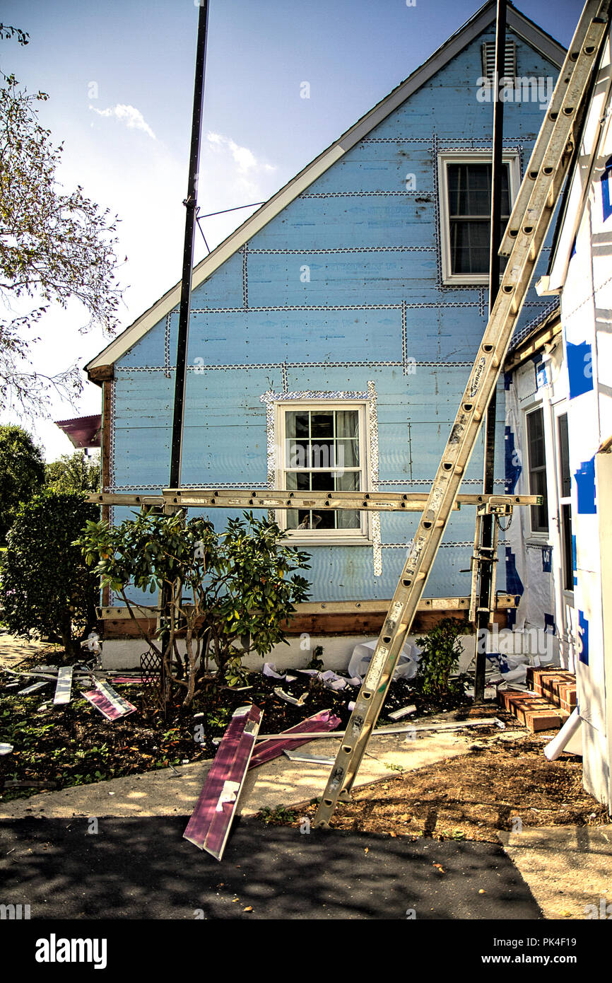 Home in the process of putting on new vinyl siding. Under construction ...