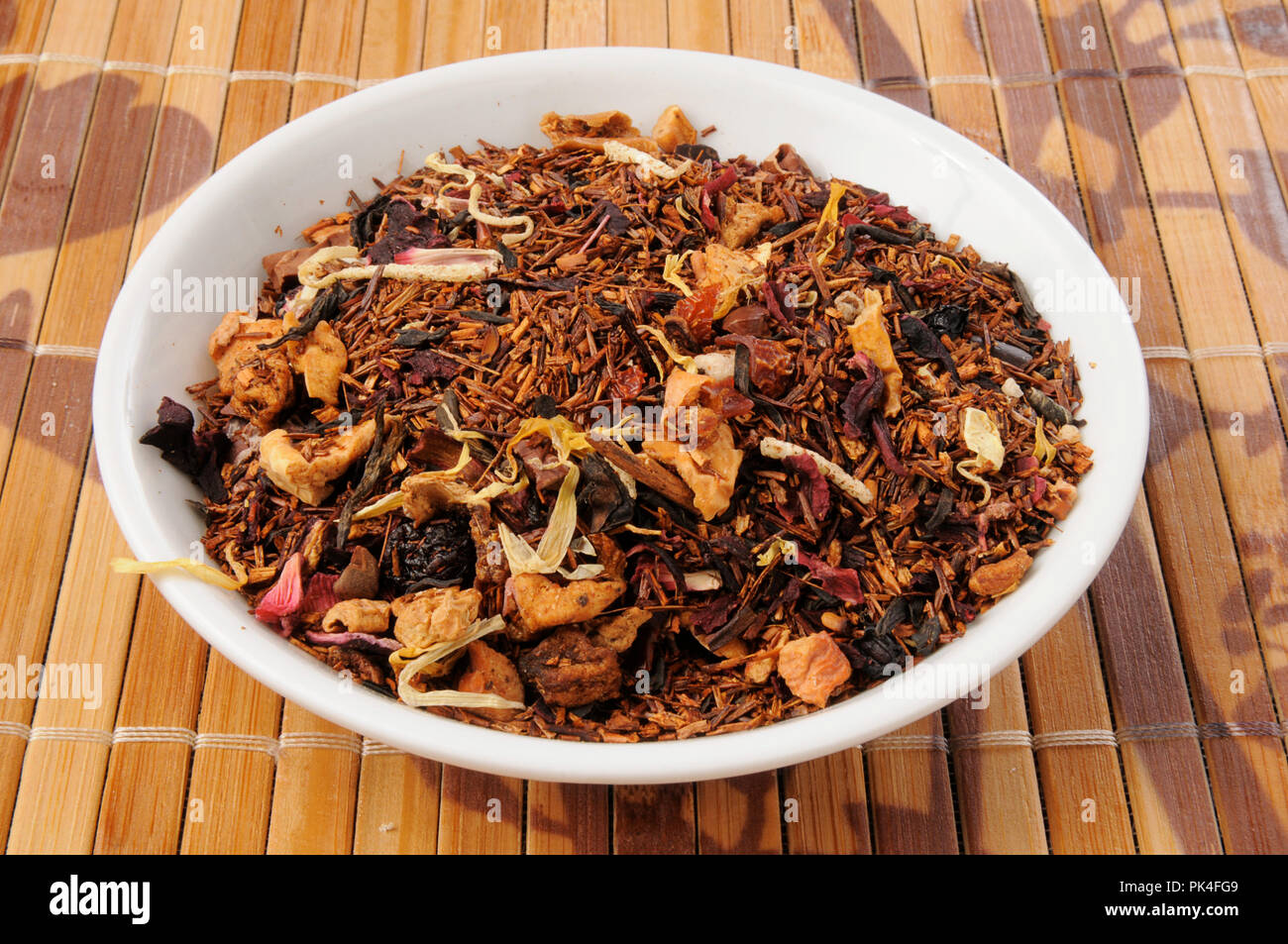 A sample dish of whole leaf honey spice rooibos tea Stock Photo - Alamy