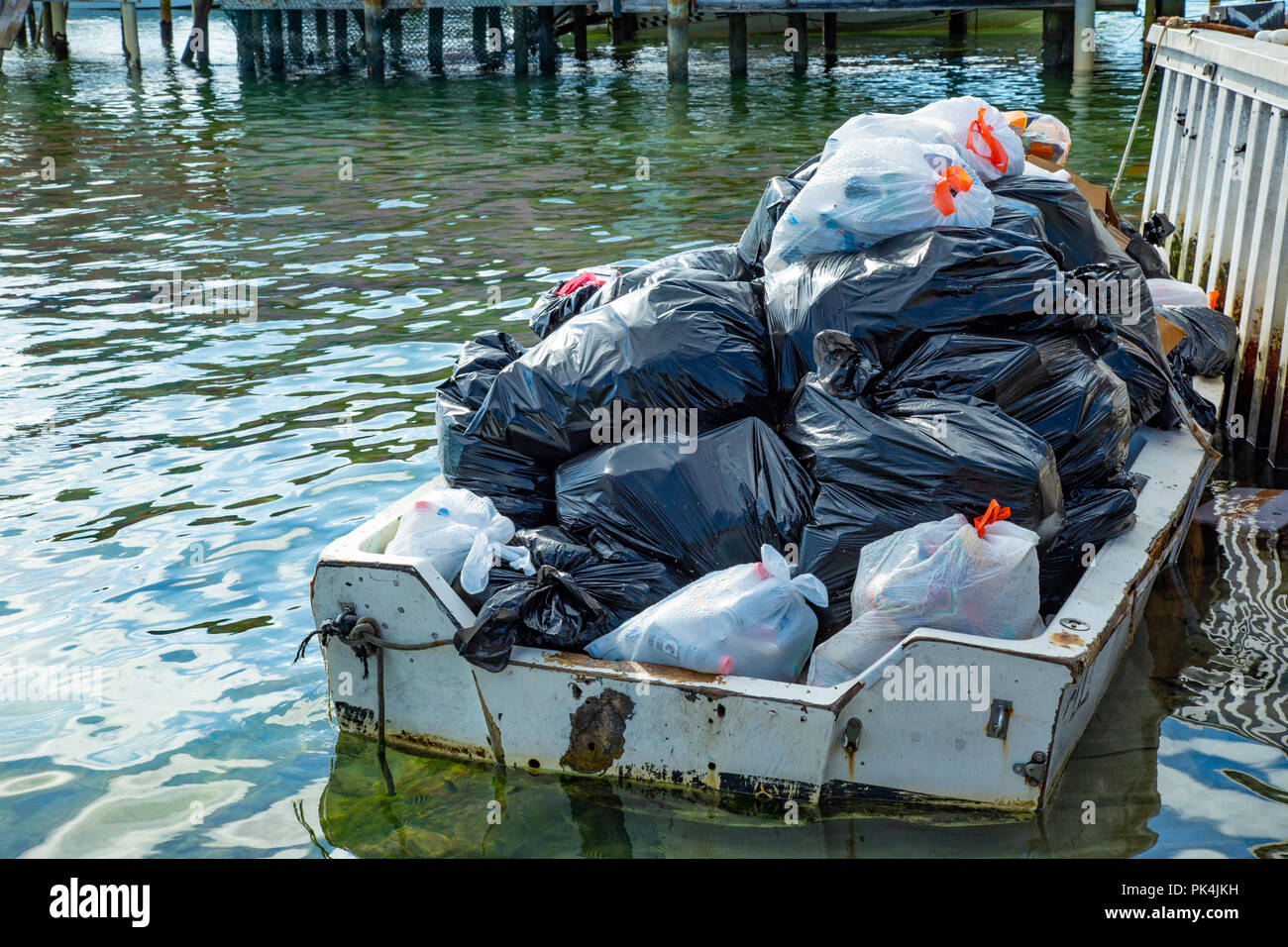 Trash collection boat in Grand Cay Abacos Bahamas Stock Photo - Alamy