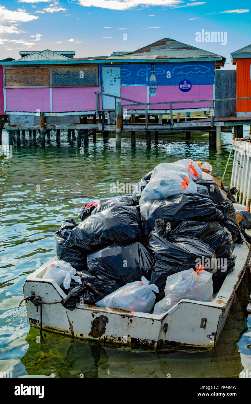 Trash collection boat in Grand Cay Abacos Bahamas Stock Photo - Alamy