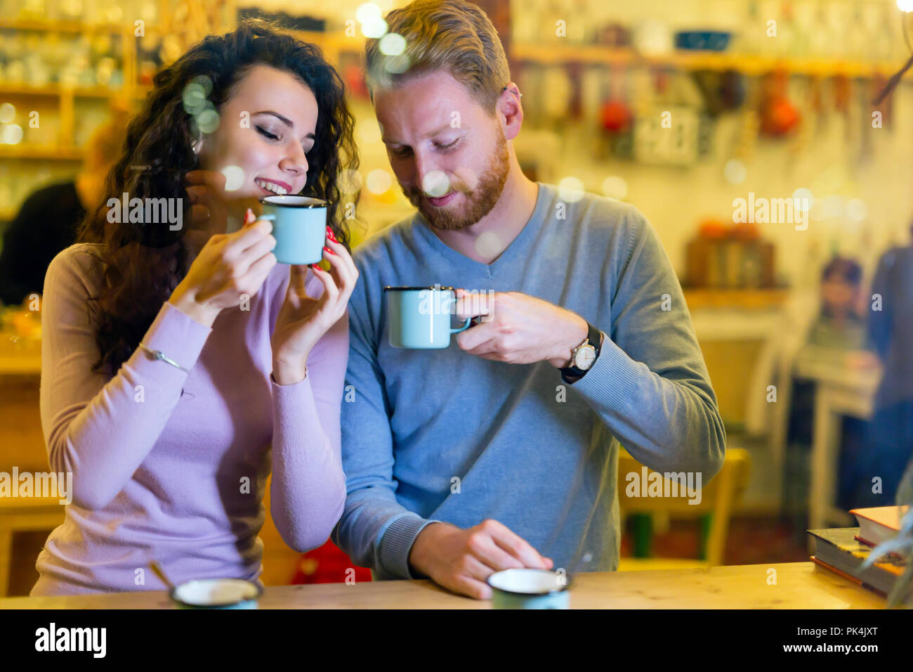 Romantic couple having date in coffee shop Stock Photo - Alamy