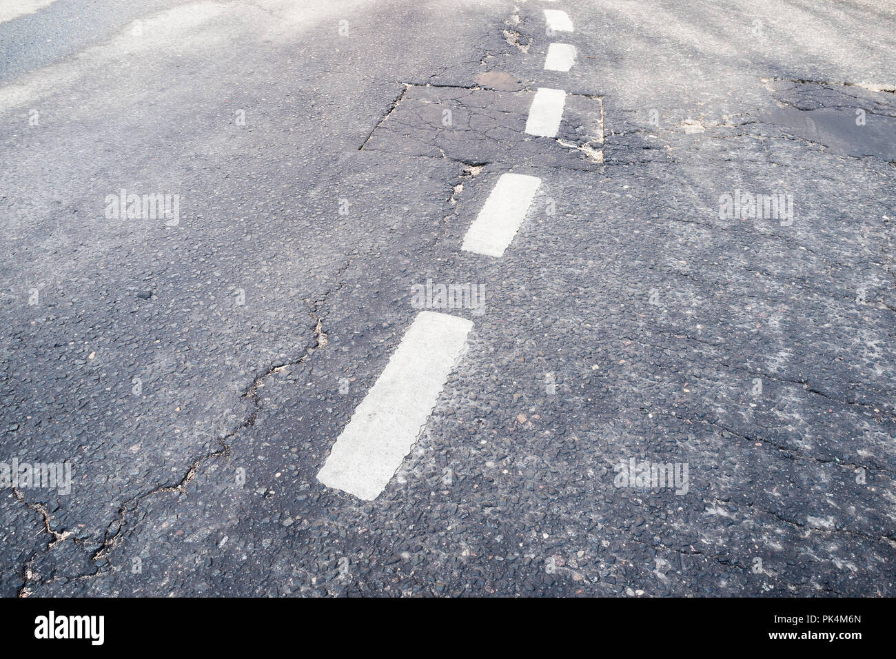 broken white separation line on an old asphalt road Stock Photo - Alamy