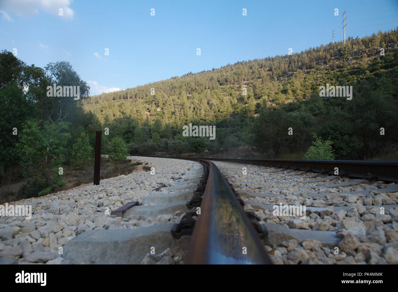 a railway running to mountain Stock Photo - Alamy