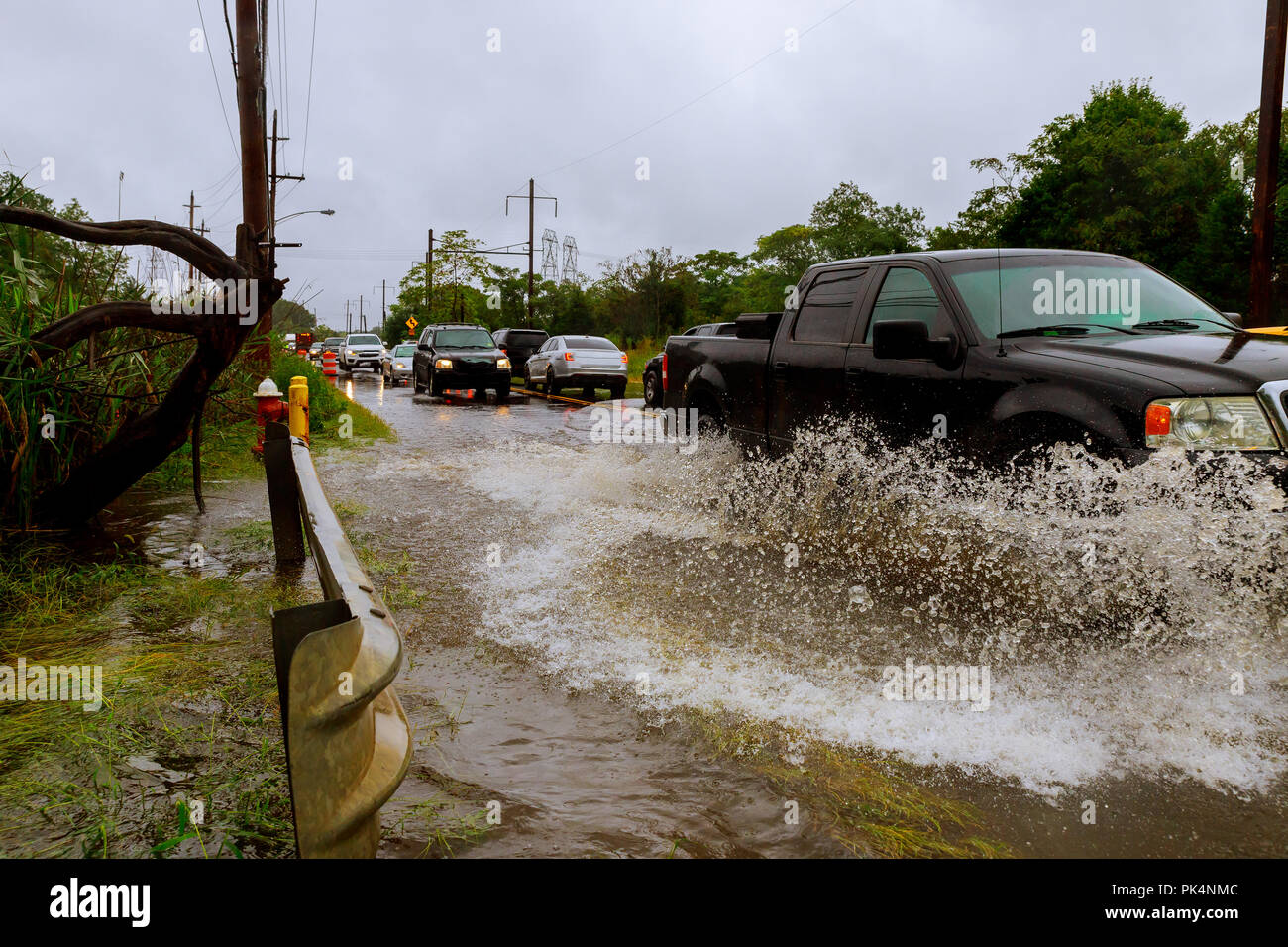 10 SEPTEMBER 2018 NJ USA: Flooded feeder street splash by a car Heavy ...