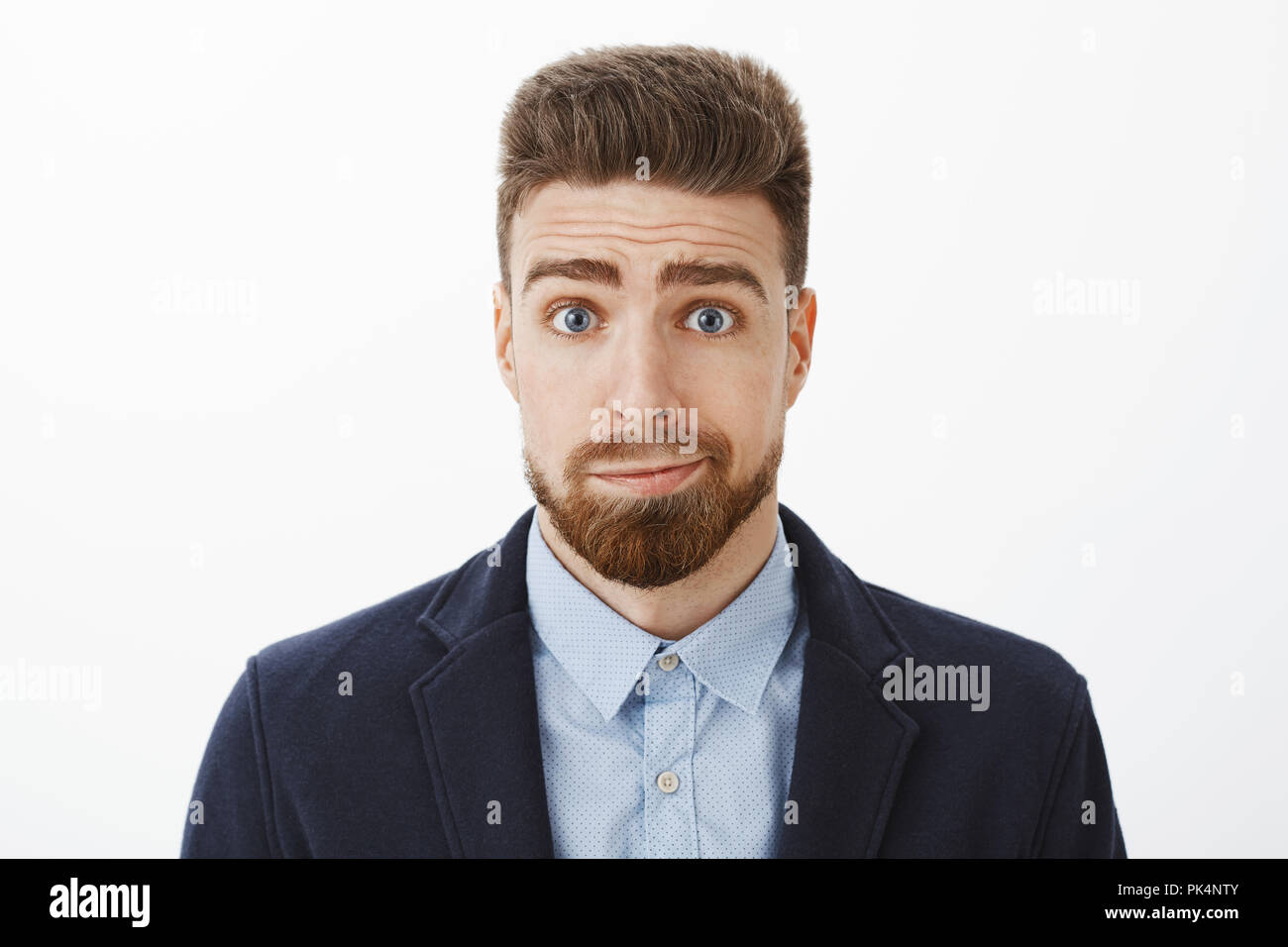 Smirking man in suit hi-res stock photography and images - Alamy
