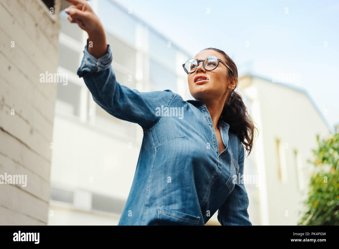 Close up of young attractive bespectacled woman looking aside Stock ...