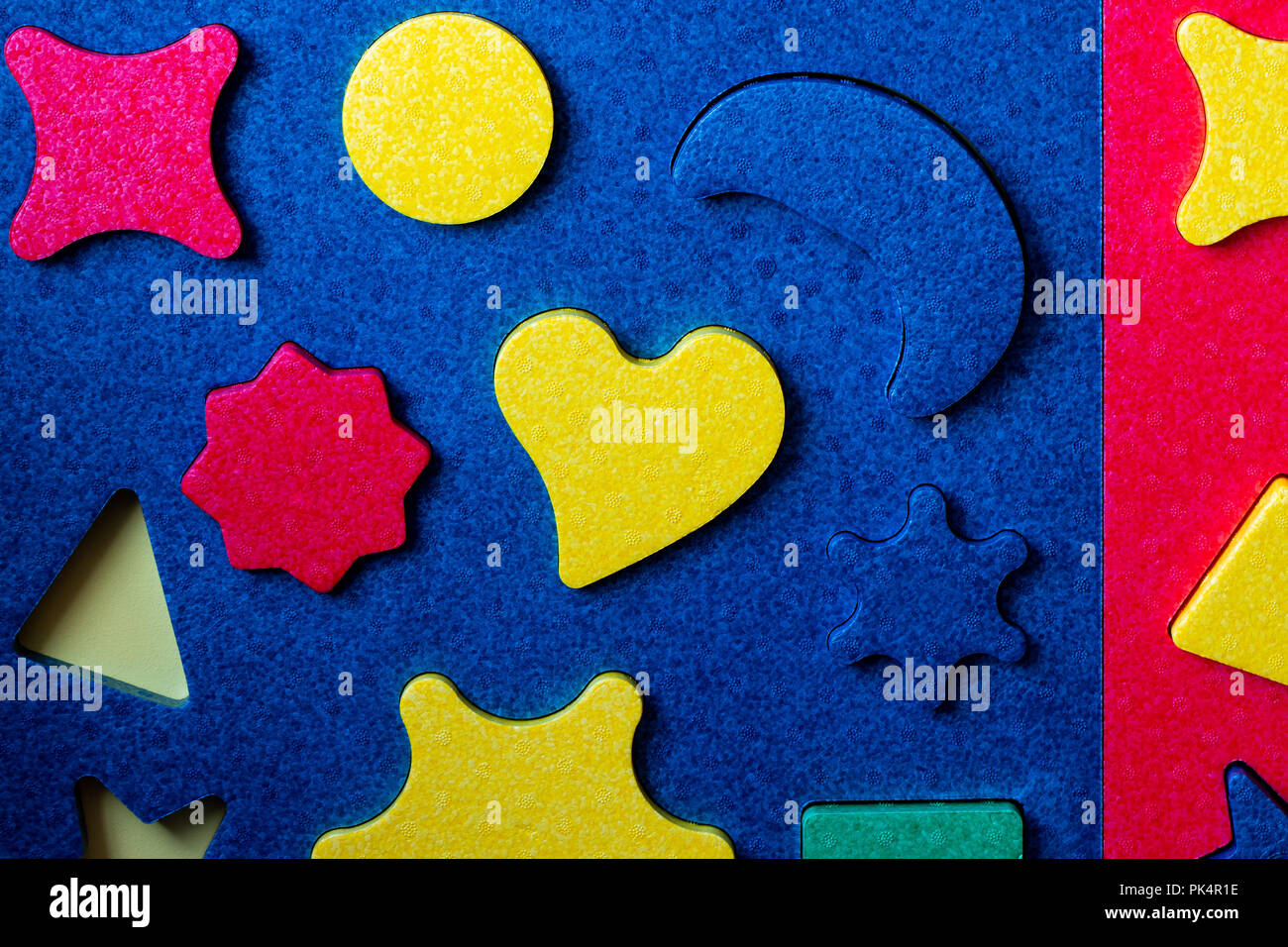 bright colorful puzzle with geometric shapes close up Stock Photo - Alamy