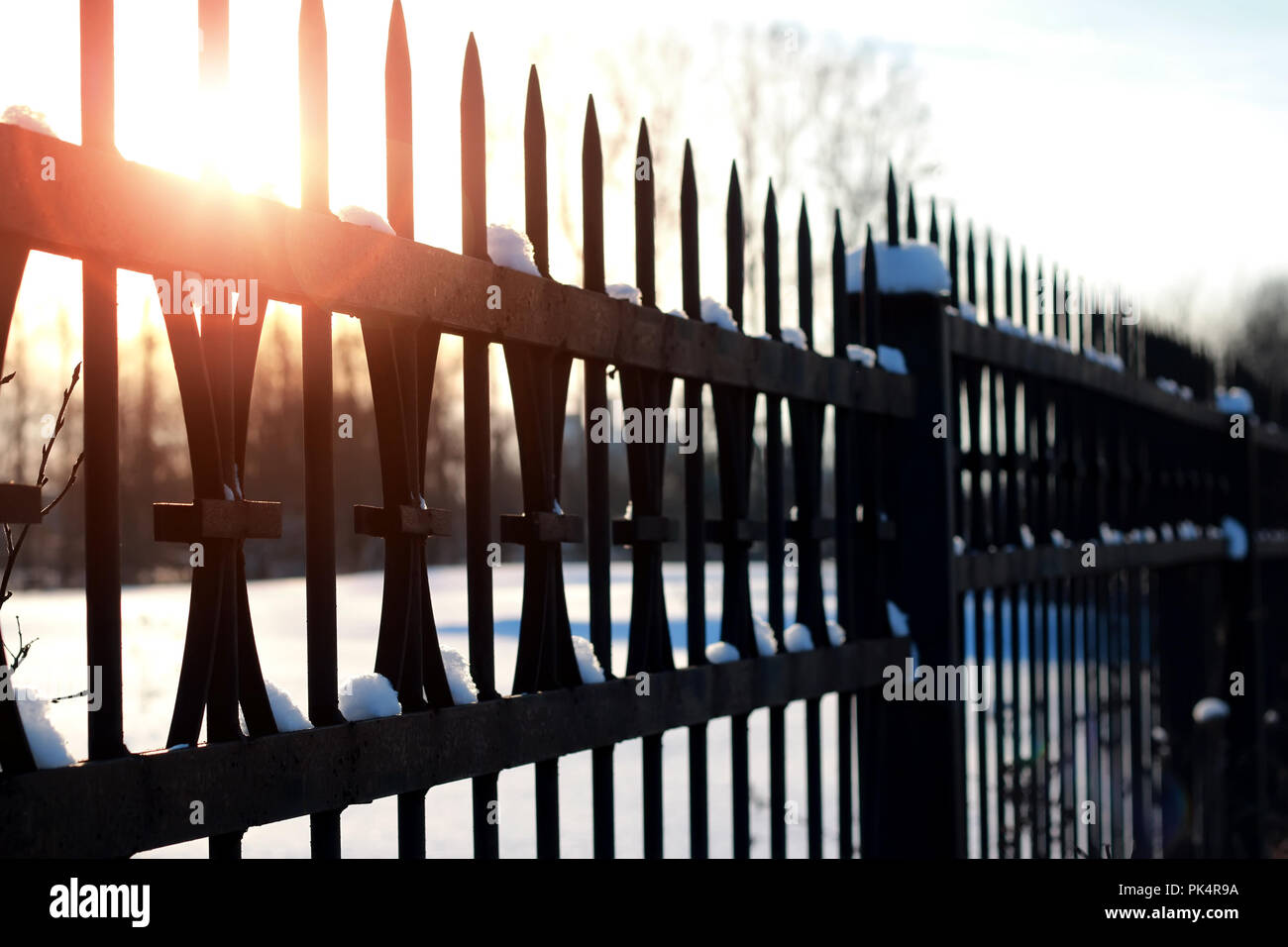 fence with spikes sun Stock Photo - Alamy