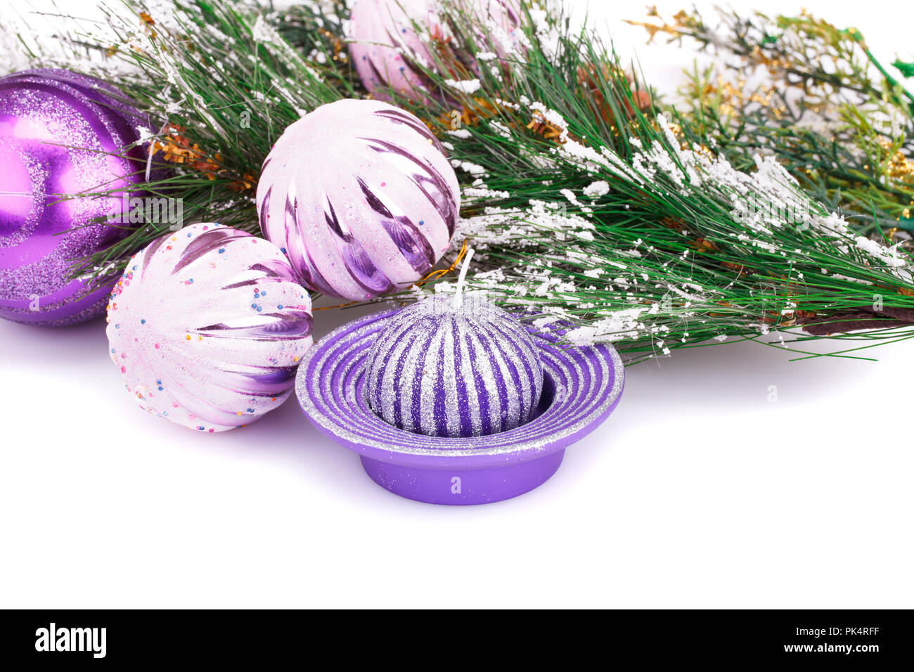 Christmas pink balls, candle and fir tree on white background Stock ...