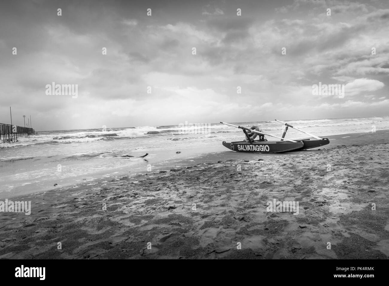 rescue boat in black and white on beach on a bad weather day Stock ...