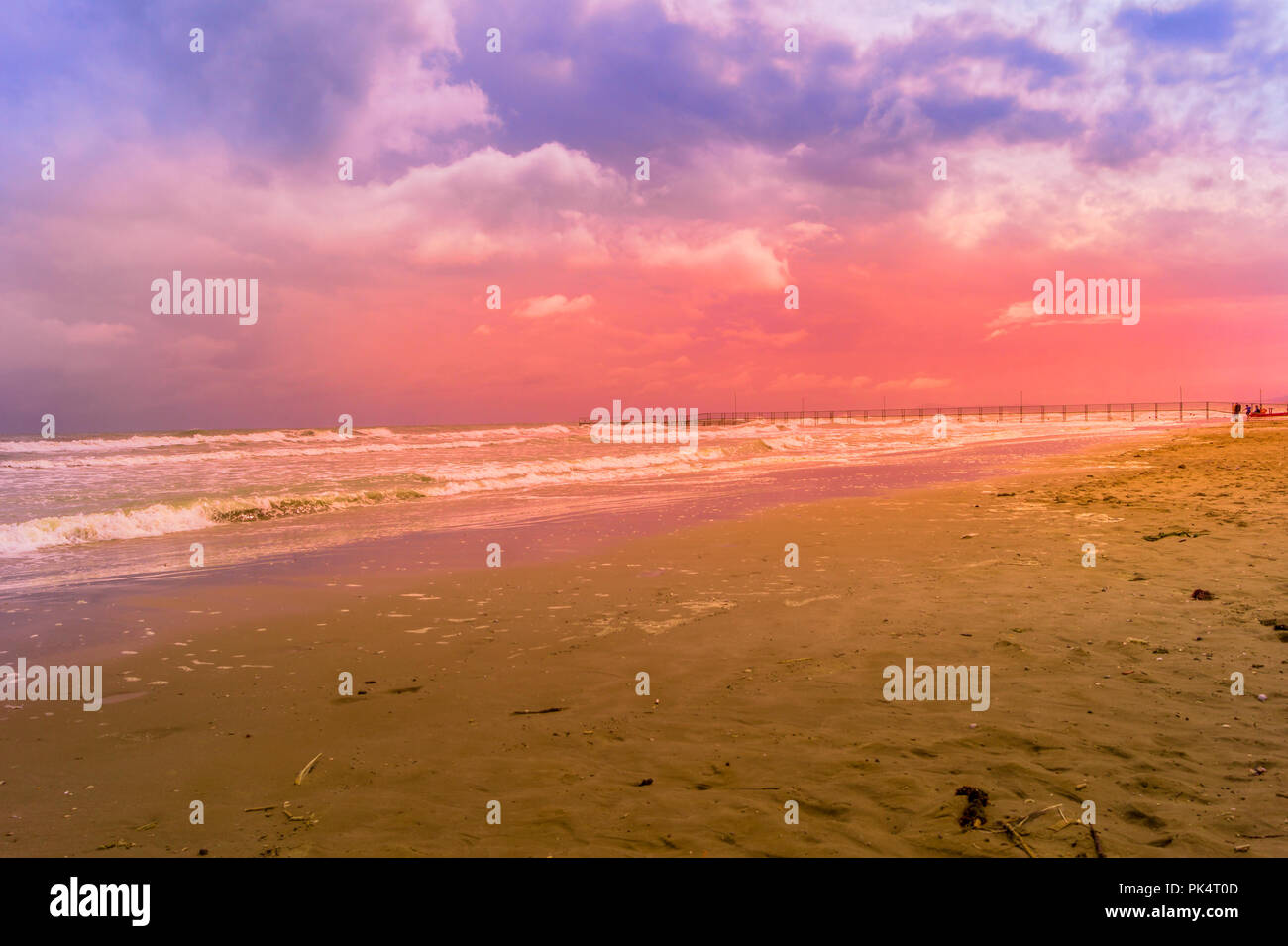 sunset at beach on a bad weather day Stock Photo - Alamy