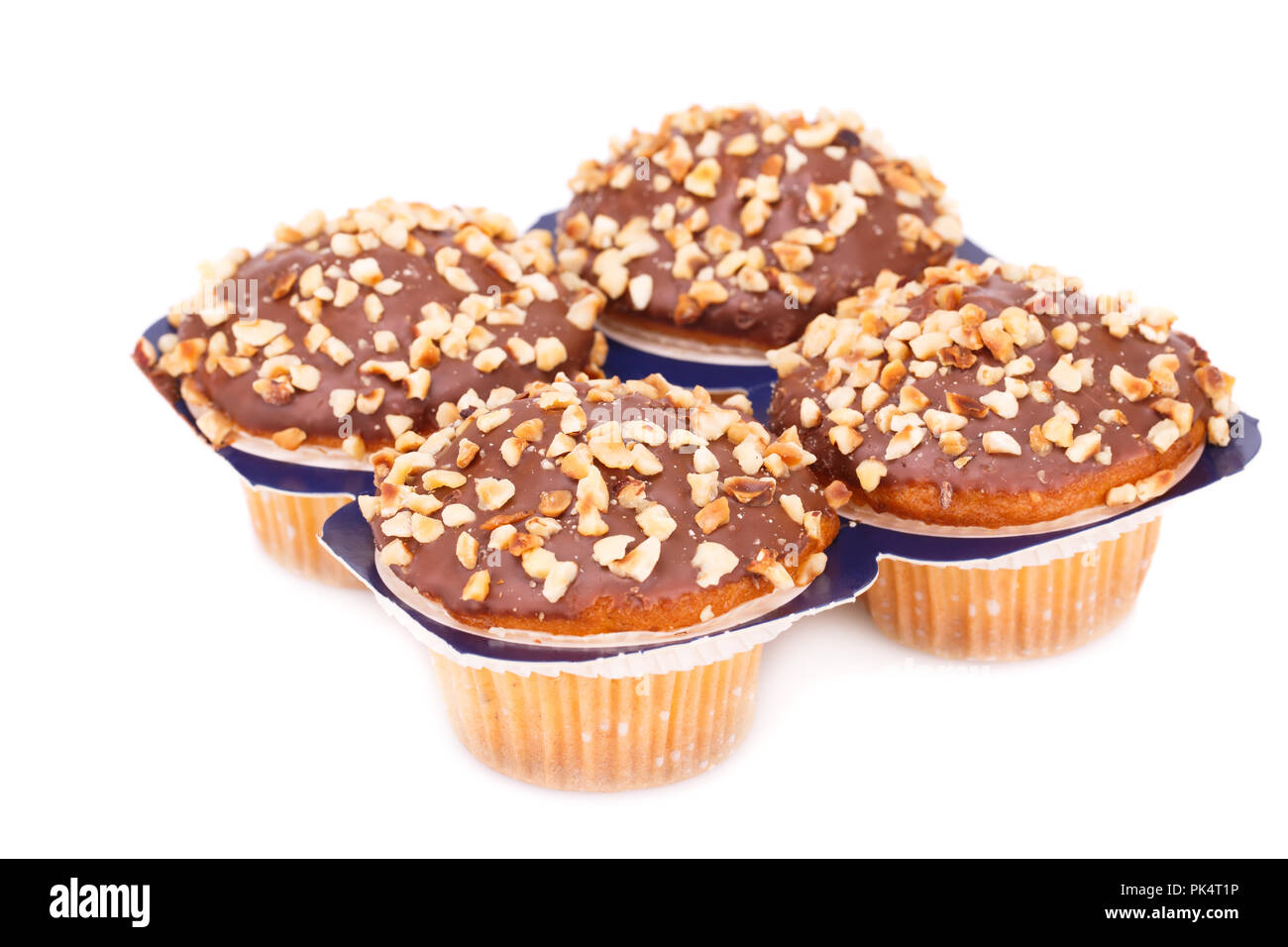 Four muffins with chocolate and nuts isolated on white background Stock ...