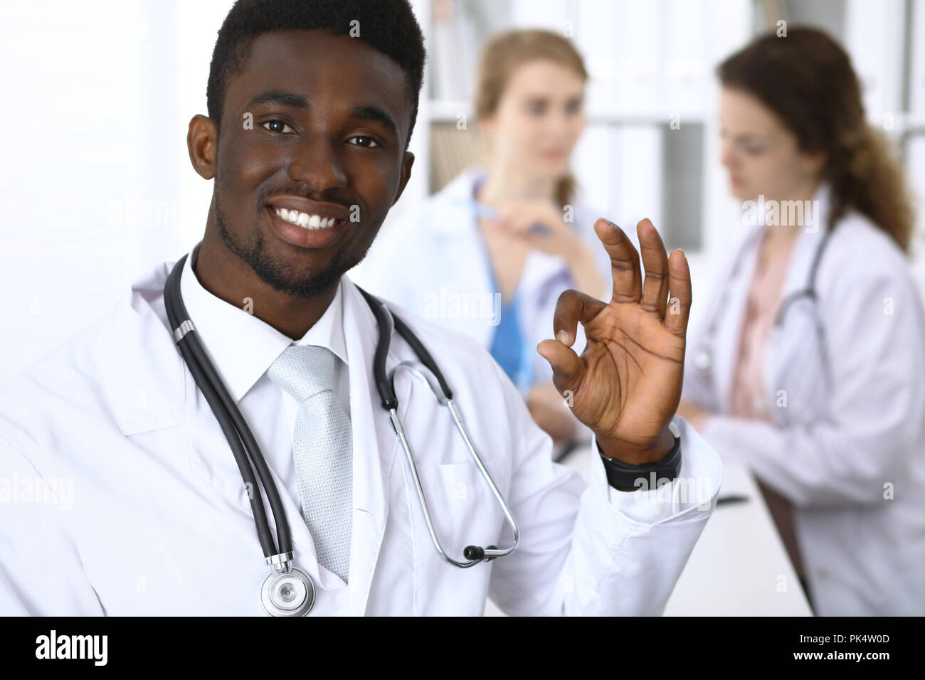 Attractive confident male african doctor hi-res stock photography and ...