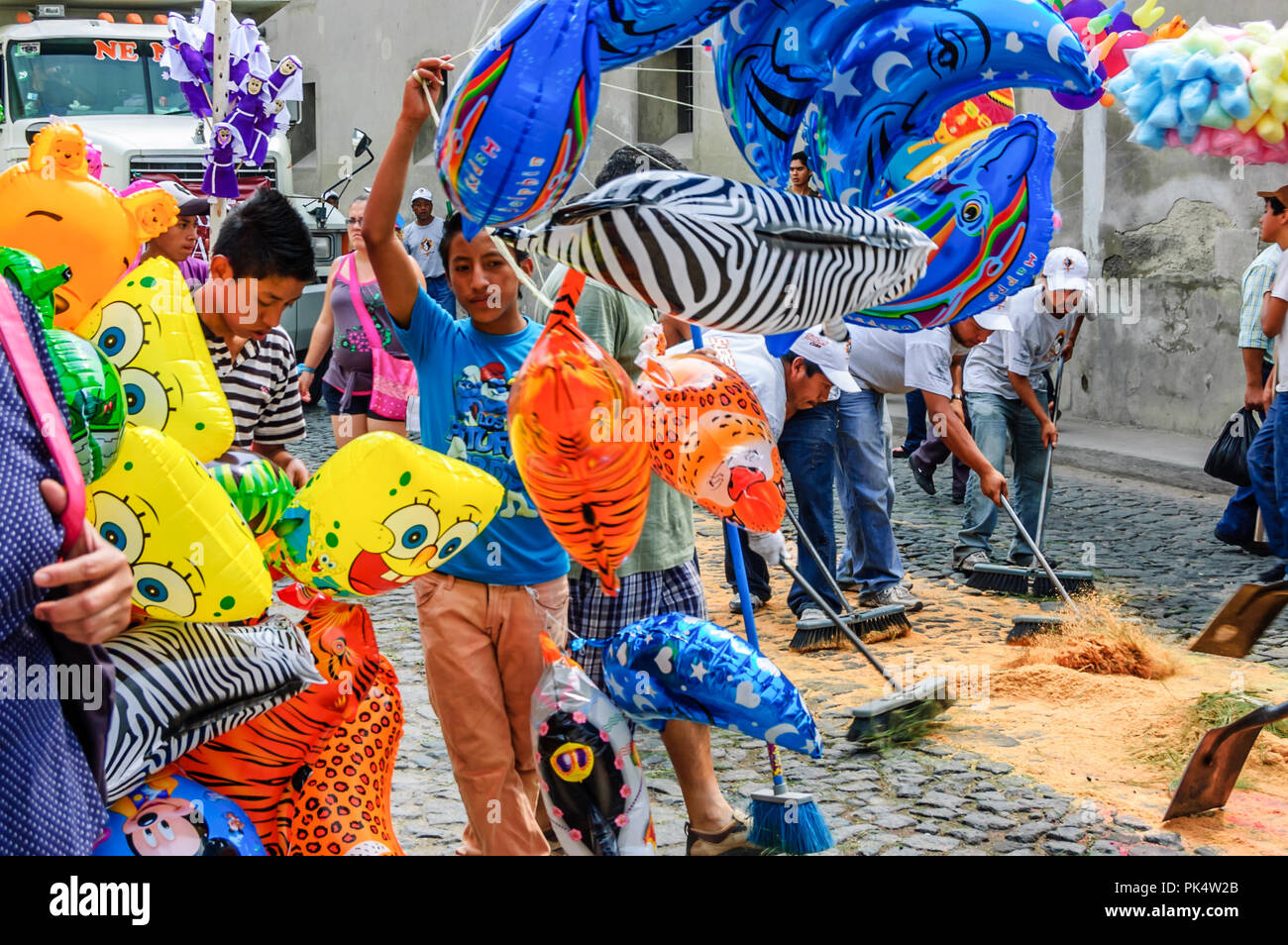 Antigua, Guatemala - April 1, 2012: Selling balloons & clearing up ...