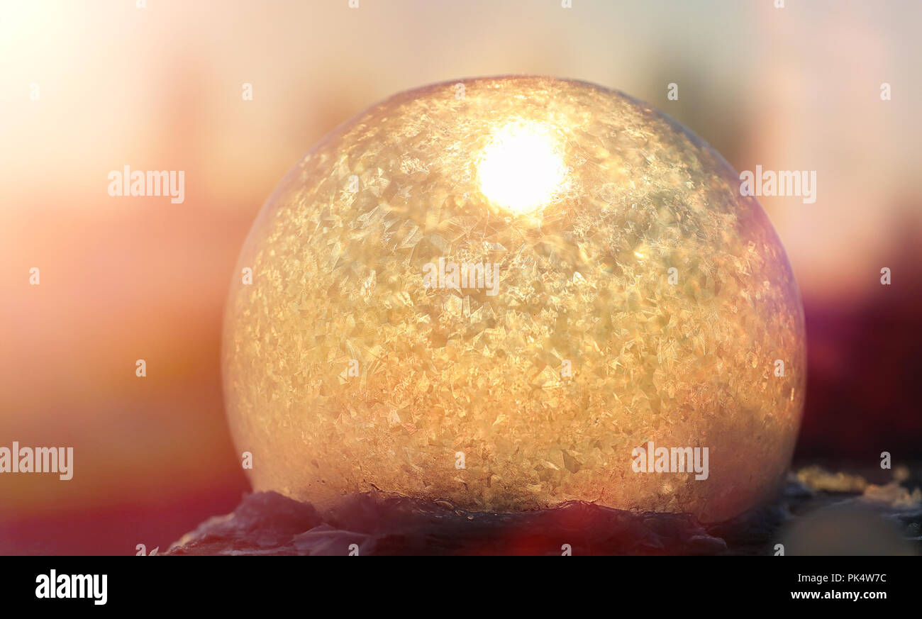 Soap bubbles freeze in the cold. Winter soapy water freezes in t Stock ...