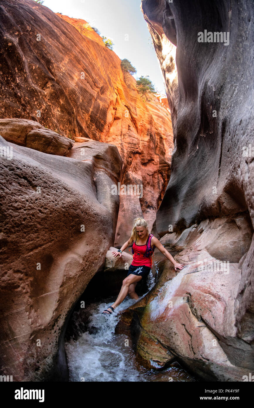 Woman hiking in Kanarra Creek Canyon, Kanarraville, Iron County, Utah ...