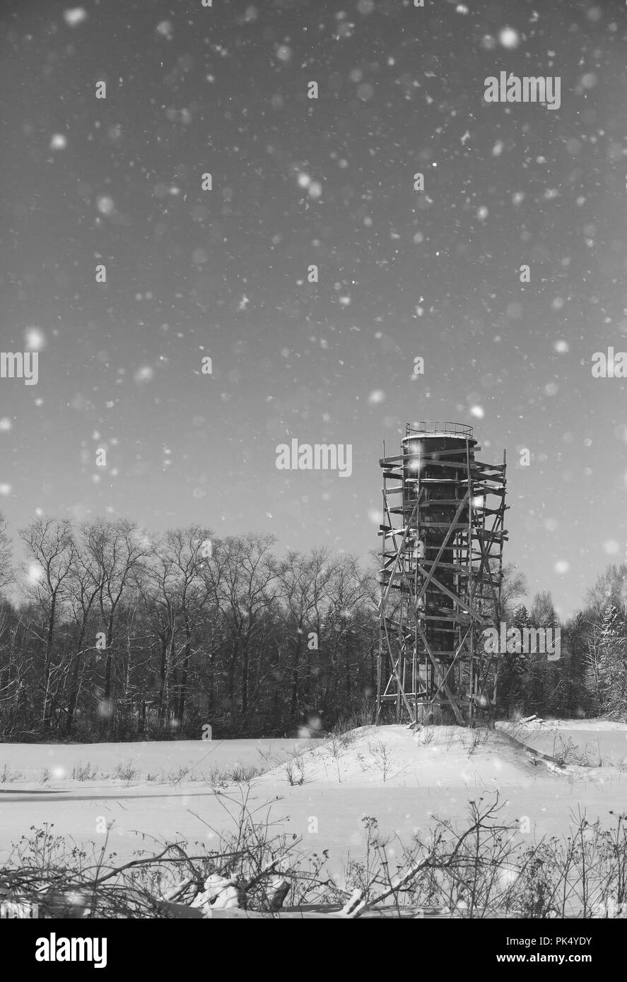 Monochrome scaffold around the water tower in field in front of Stock ...