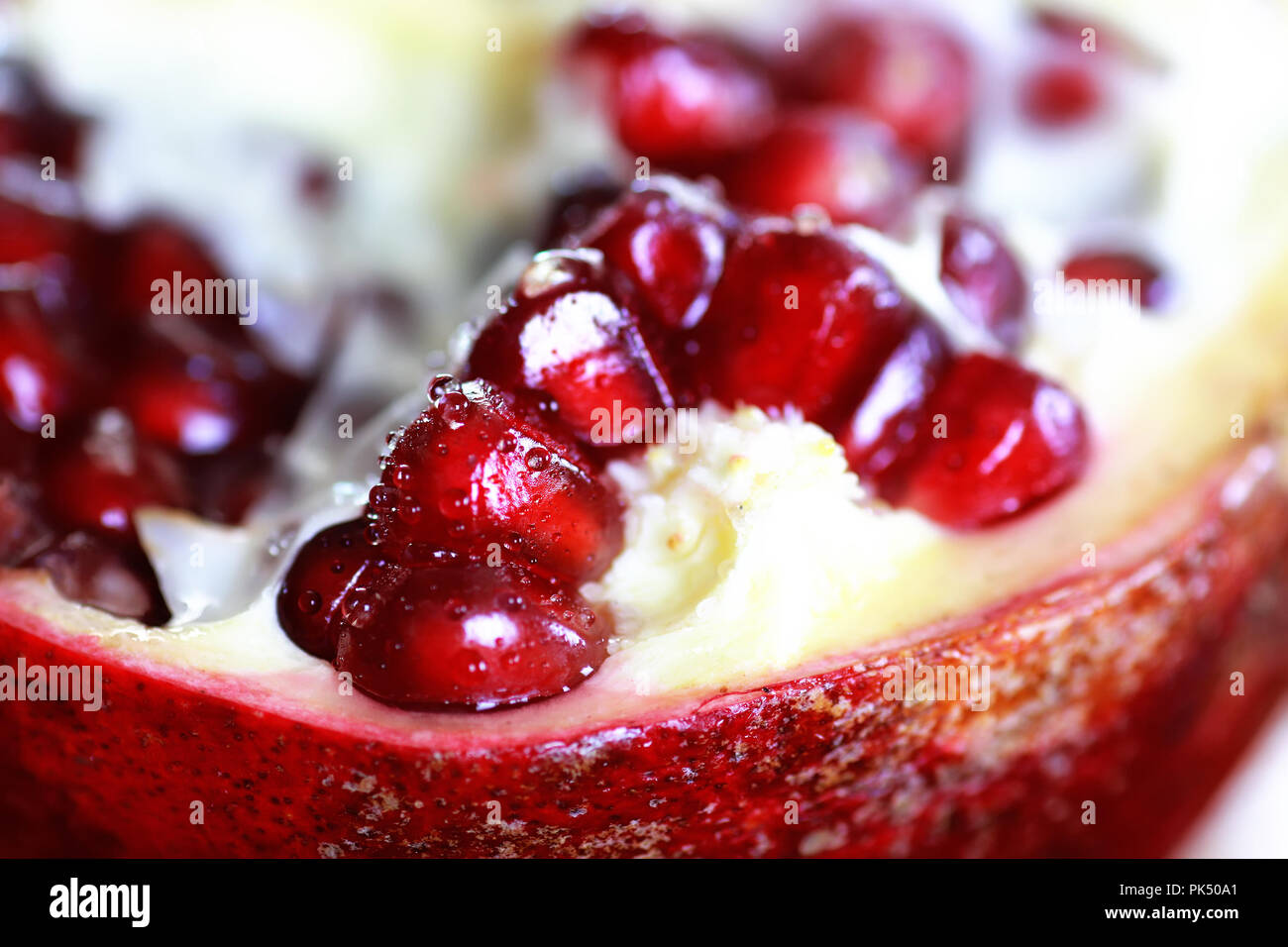 pomegranate seed wood background Stock Photo - Alamy