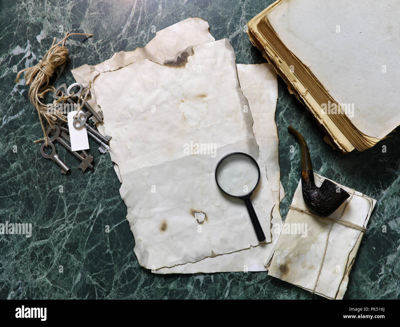 retro papers and book on detective work table with tools Stock Photo ...