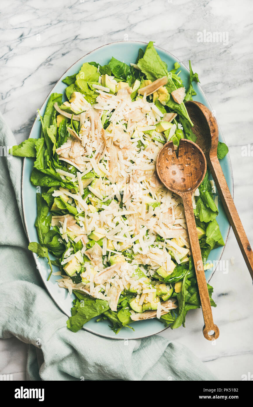 Mediterranean meze snack. Flat-lay of artichoke, rocket and hard cheese ...