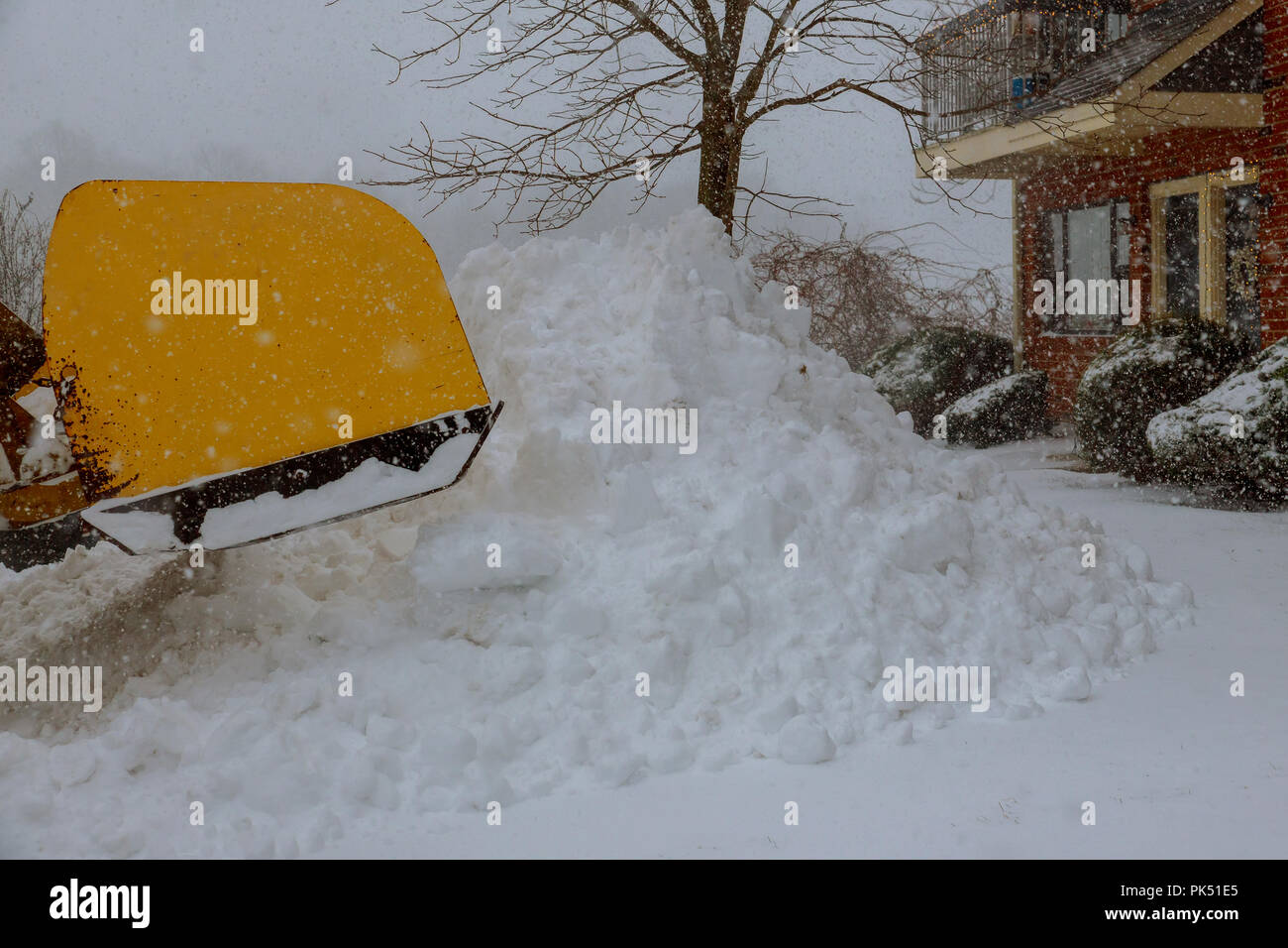 Snow clearing. Tractor cleaning snow the way after heavy snowfall Stock ...