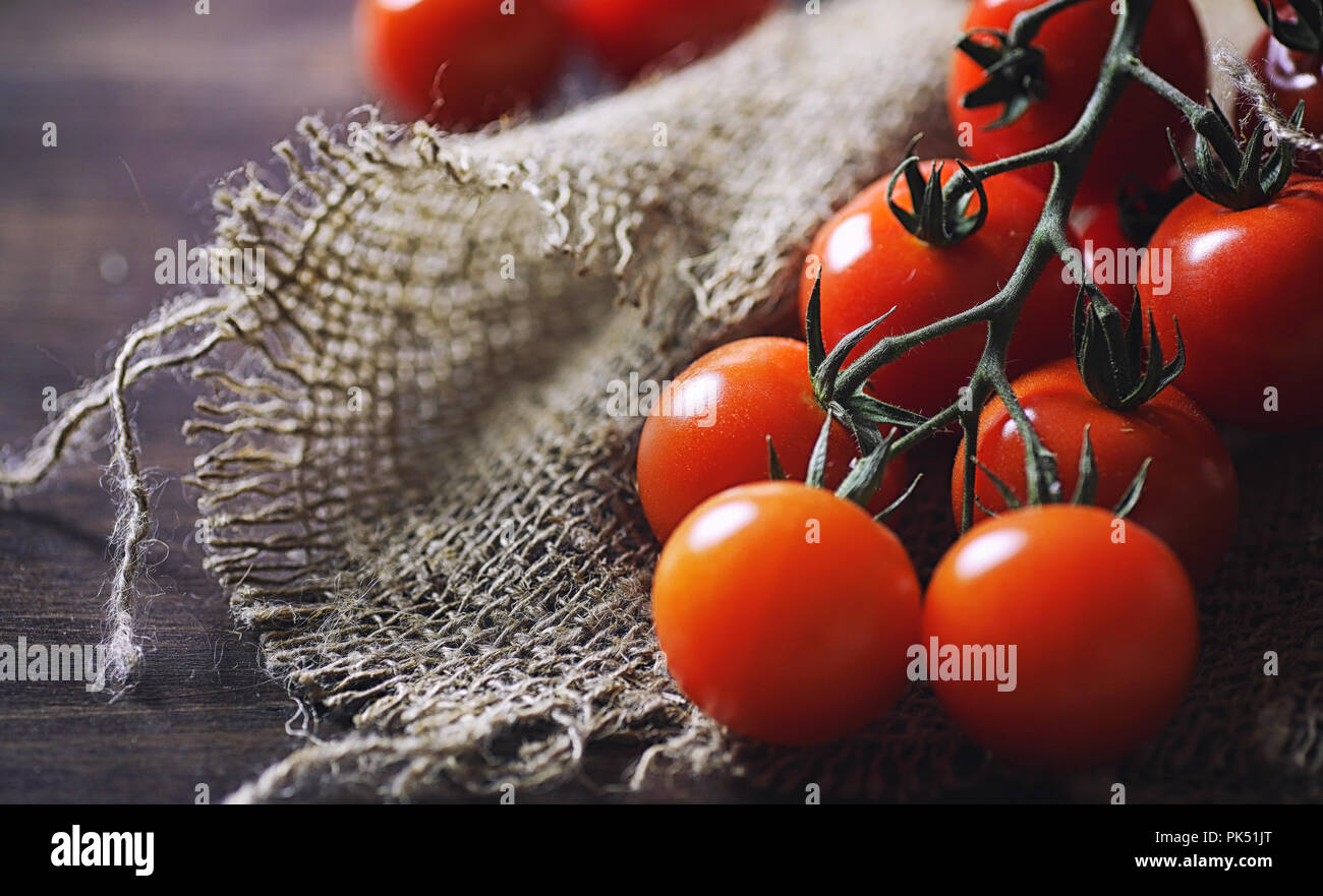 Branch with fresh cherry tomatoes. Ripe red tomatoes Stock Photo - Alamy