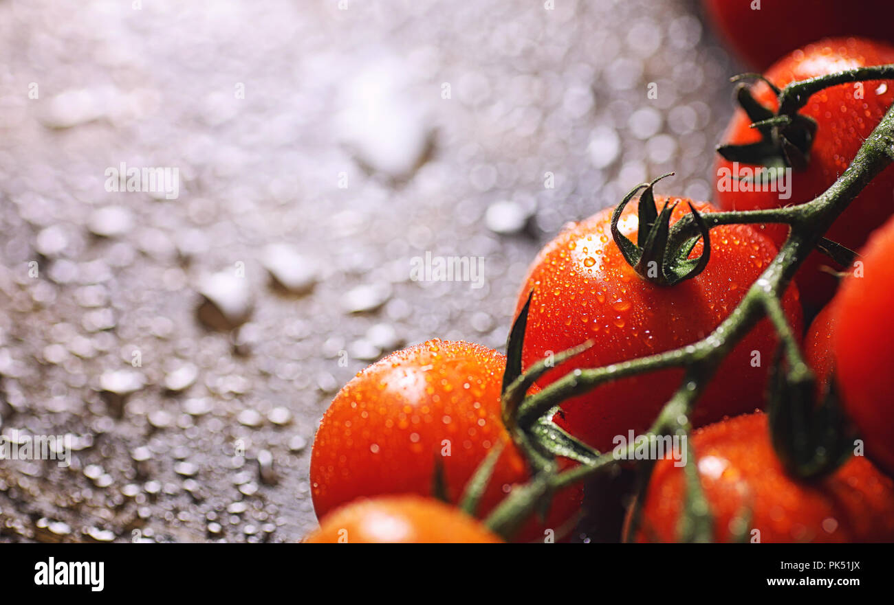 Branch with fresh cherry tomatoes. Ripe red tomatoes Stock Photo - Alamy
