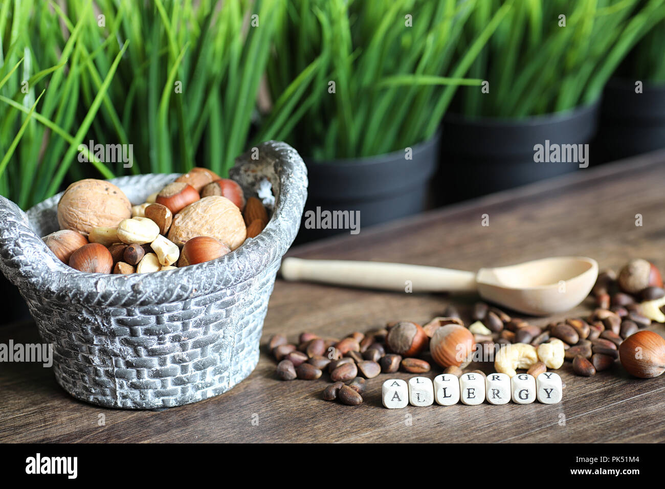 tasty nuts on a wooden table Stock Photo - Alamy