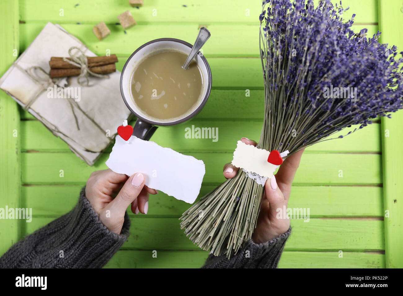 Girl drinking hot coffee and looks presented valentines Stock Photo - Alamy