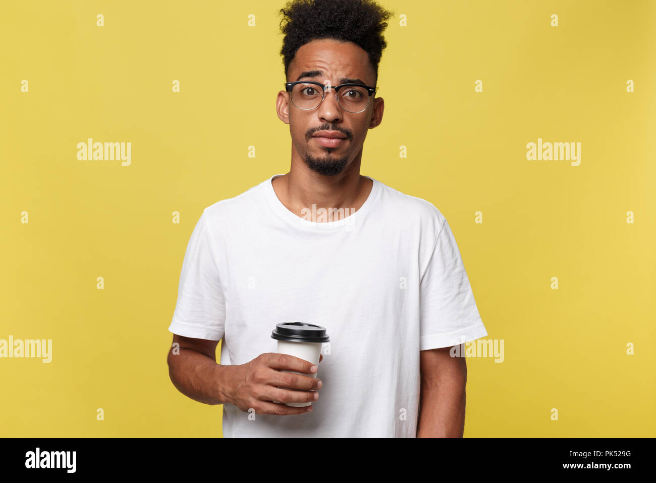 Stylish young afro american man holding cup of take away coffee ...