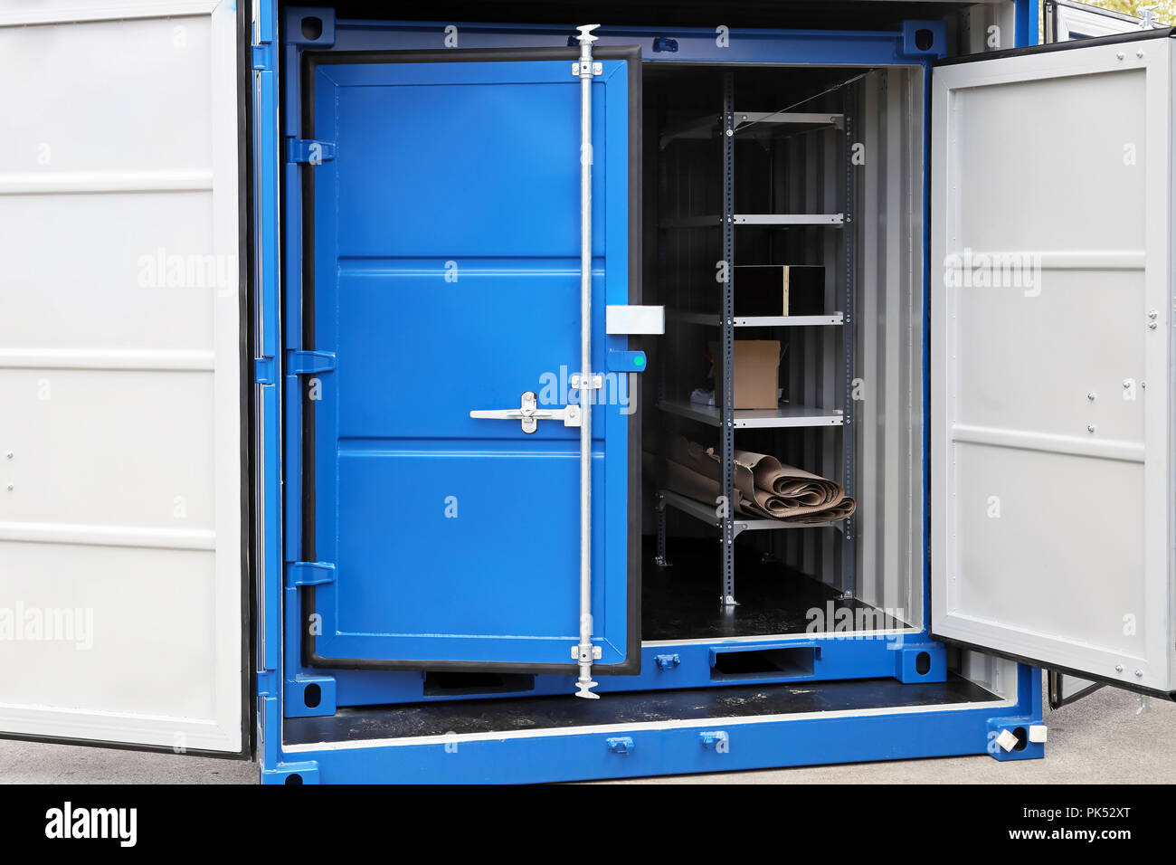 Open door at new blue shipping container Stock Photo - Alamy