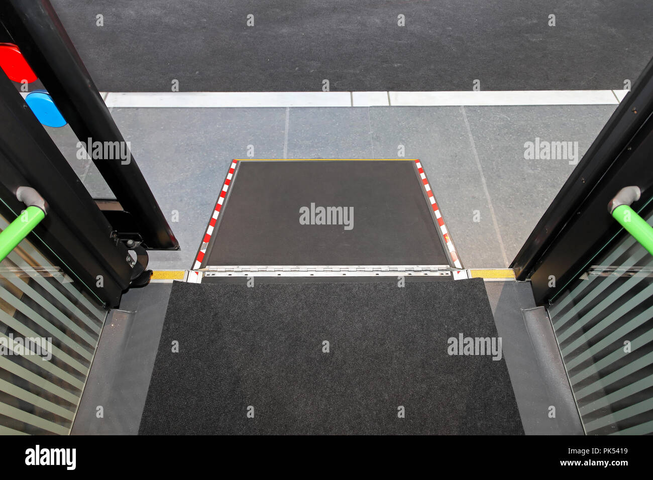 Retractable ramp for wheelchair at city bus Stock Photo - Alamy