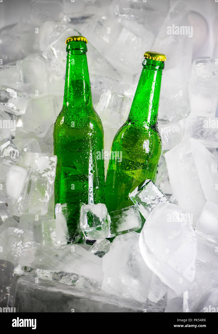 Bottles of beer on ice Stock Photo - Alamy