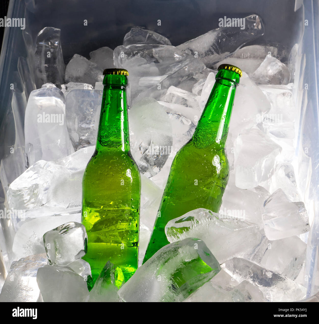 Bottles of beer on ice Stock Photo - Alamy