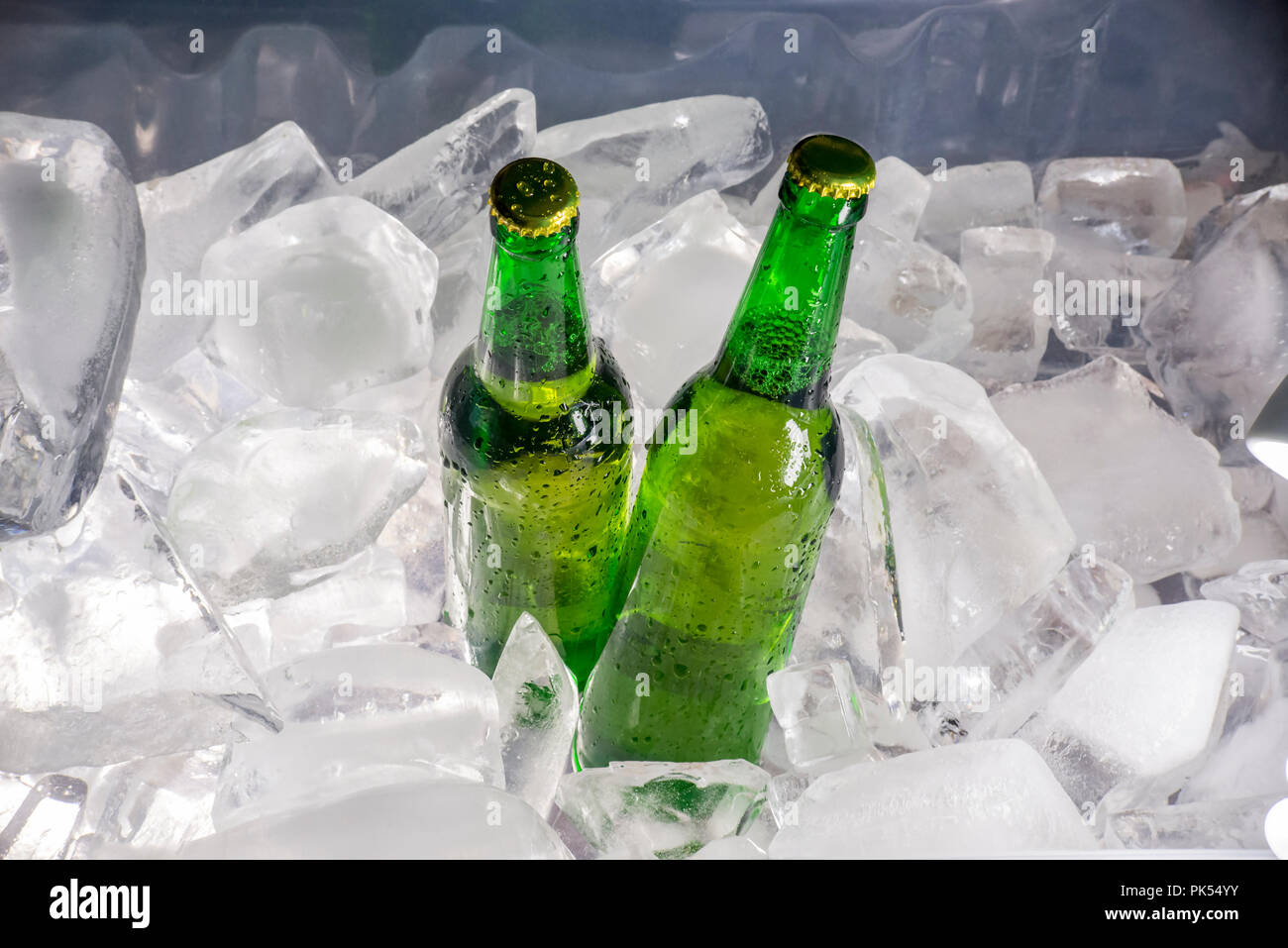 Bottles of beer on ice Stock Photo - Alamy