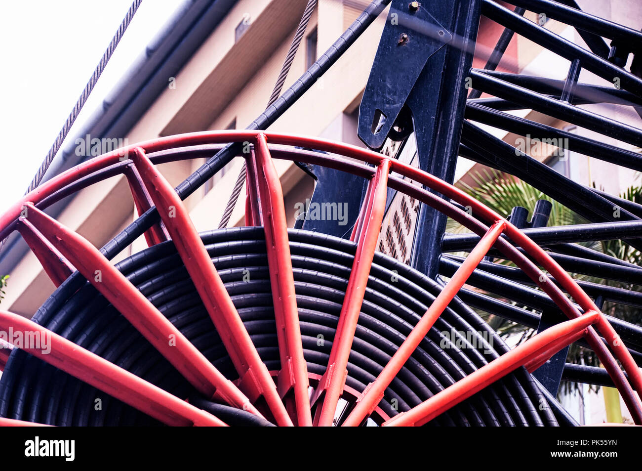 An abstract picture of a cable wound around a spool on a large crane in ...