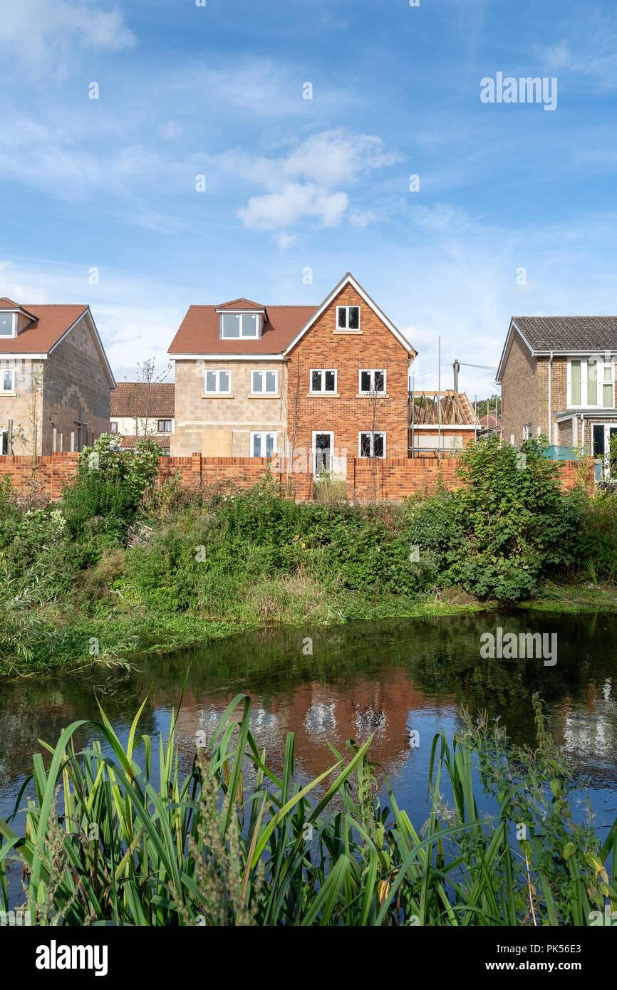 New build house next to river Stock Photo - Alamy