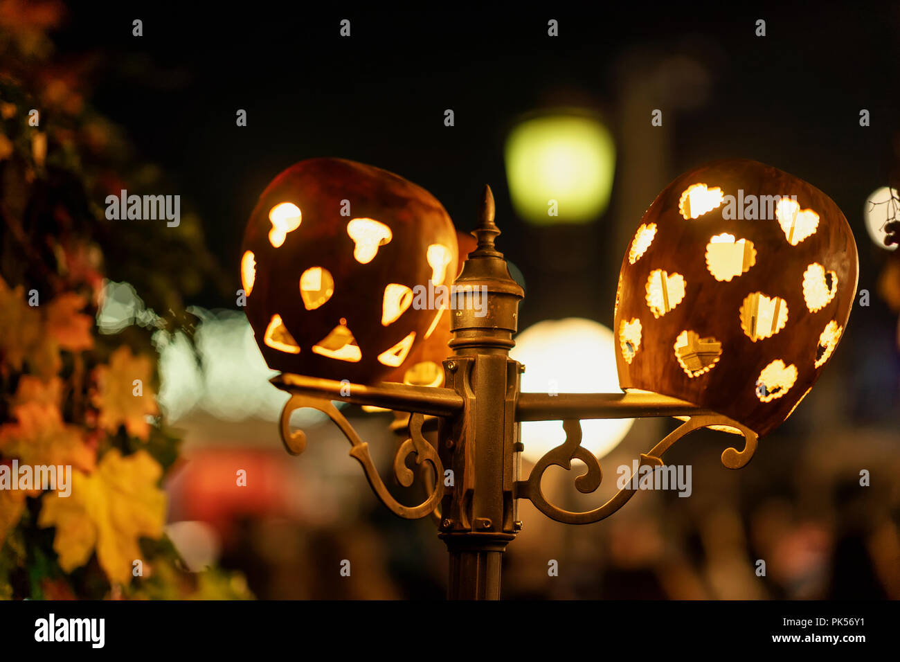 Holidays illumination, electric street lamp decorated with carved ...